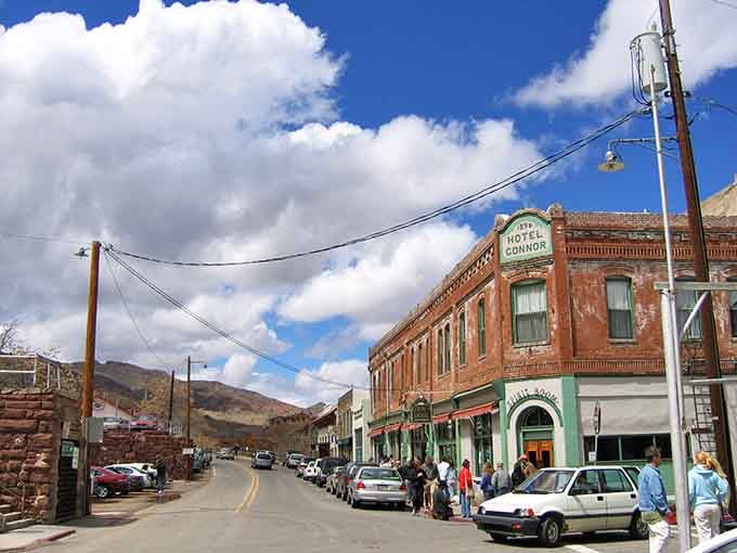 The Hotel Connor's weathered brick stands proud against dramatic clouds, a testament to mountain town resilience.