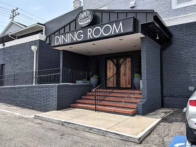 Those dramatic wooden doors and brick steps announce serious seafood awaits behind this modern charcoal-gray facade.