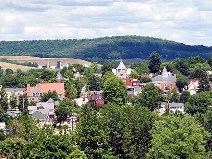 Nestled in rolling hills, this picturesque town looks like someone painted it just for postcards.