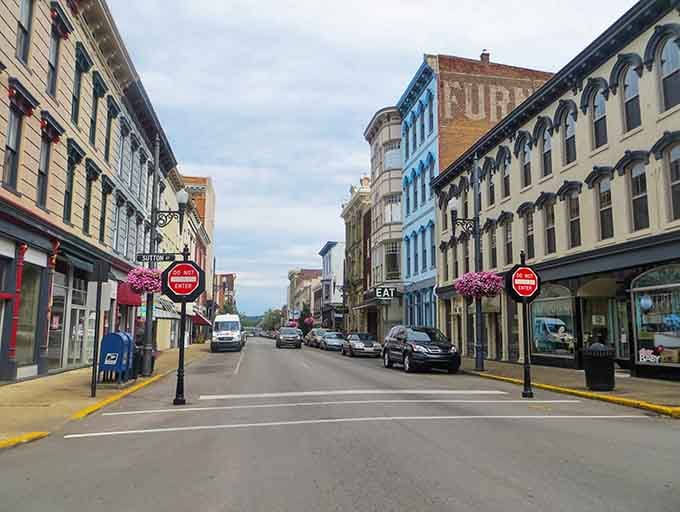 Those hanging flower baskets and historic facades create a Main Street that looks like it stepped out of a postcard.