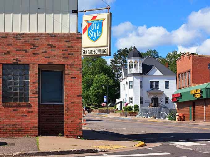 That vintage Old Style sign hanging above brick buildings tells you this town remembers when handshakes sealed every deal.