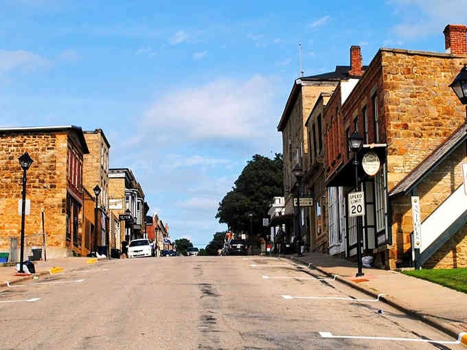 Limestone buildings line these historic streets where Cornish miners once walked, their stone craftsmanship still standing strong and beautiful.