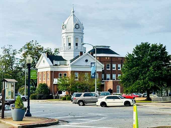 This stately white courthouse tower rises like a beacon, reminding you that some towns still value tradition.