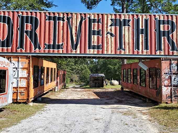 That weathered "Drive Thru" sign promises the most delightfully bizarre museum experience you'll ever have from your car.