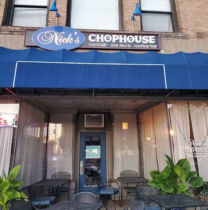 That bold blue awning announces cocktails, live music, and a rooftop bar&mdash;basically the trifecta of a perfect evening out.