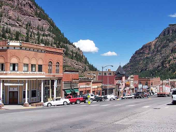 Red brick storefronts nestle into this box canyon like they've been here since Butch Cassidy's day.