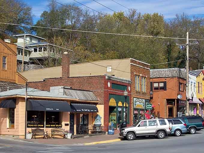 Colorful storefronts climb the hillside like a staircase to small-town heaven, each one bursting with local character.