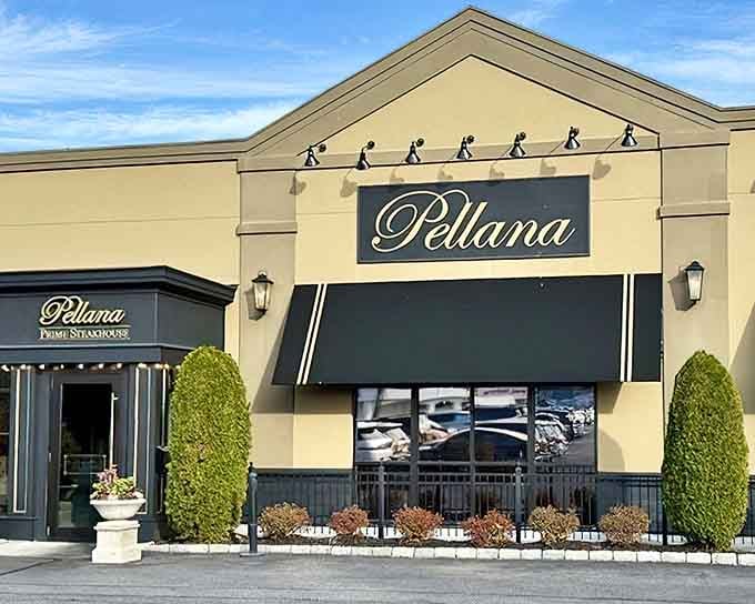 The elegant script signage and manicured landscaping hint at the prime cuts waiting inside this sophisticated steakhouse destination.