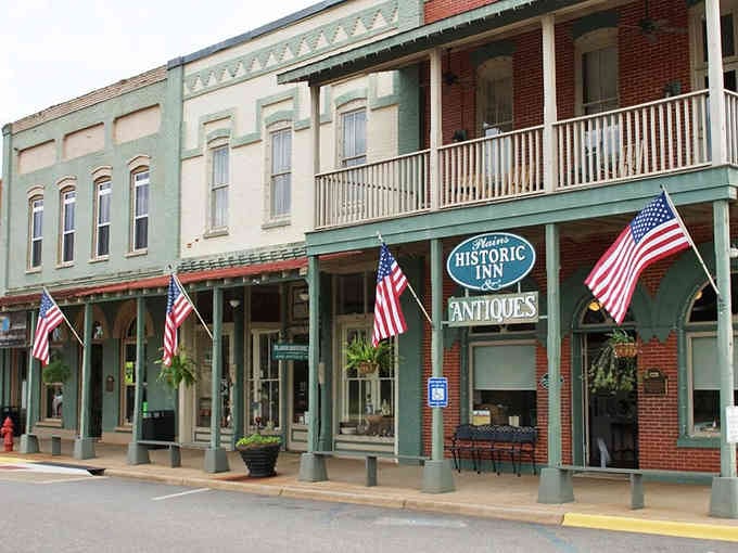 Those wraparound porches and American flags remind you when architecture actually had personality and pride.