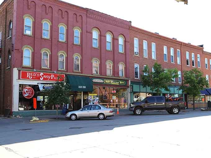 Red's Savoy Pizza beckons from a building that's served hungry folks longer than most of us have been alive.