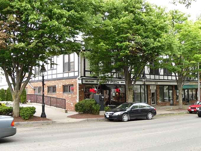 Shaded sidewalks and Tudor-style buildings make window shopping feel like an actual activity worth doing on purpose.