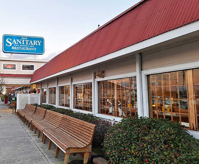 That distinctive red roof has welcomed seafood lovers since 1938, standing proud along the waterfront like a beacon.