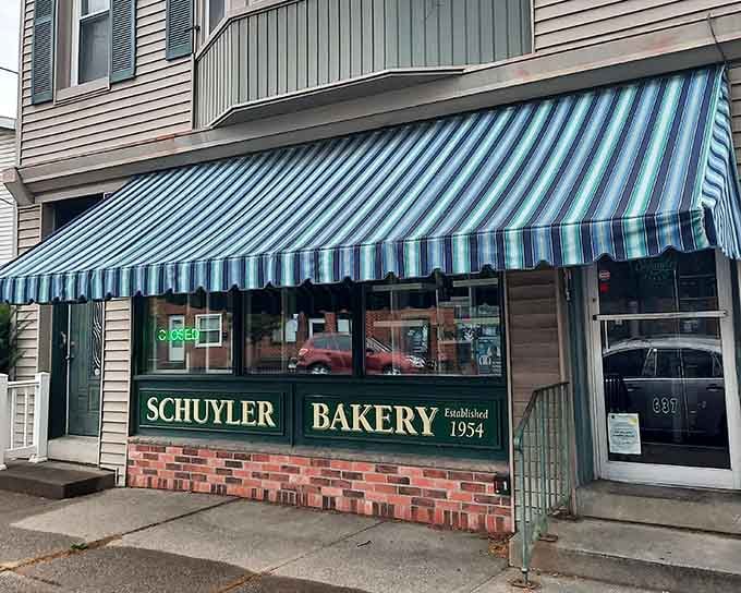 That striped awning and brick base give off serious "your grandma's favorite bakery" vibes in the absolute best way.