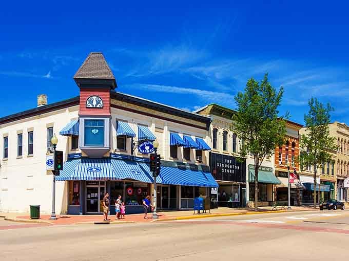 Those blue-and-white awnings frame a downtown that looks like it stepped out of a Norman Rockwell painting.