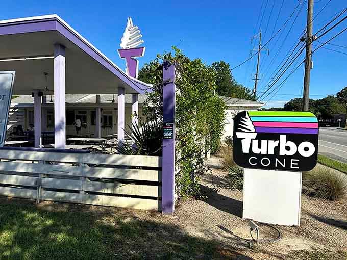 That purple-topped cone sign stands tall like a delicious lighthouse guiding you to creamy salvation.
