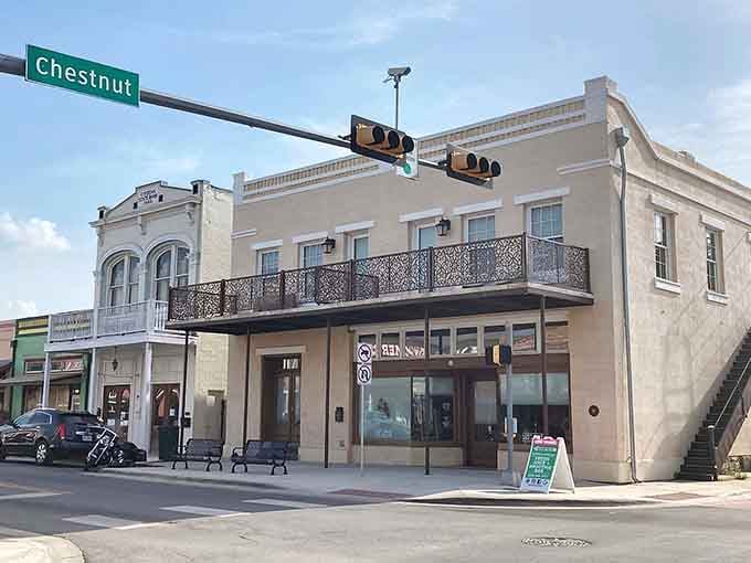 The ornate ironwork balconies give this corner a New Orleans feel transplanted to the heart of Texas Hill Country.