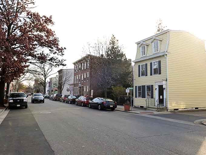 Pastel-painted homes and tree-lined streets evoke memories of simpler times when front porches were gathering places.