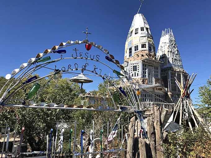 The handmade archway welcomes visitors to a castle where creativity trumps conventional construction methods and building codes.
