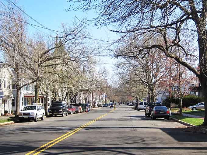 Tree-lined streets stretch peacefully ahead, inviting leisurely strolls through neighborhoods where time moves a little slower.