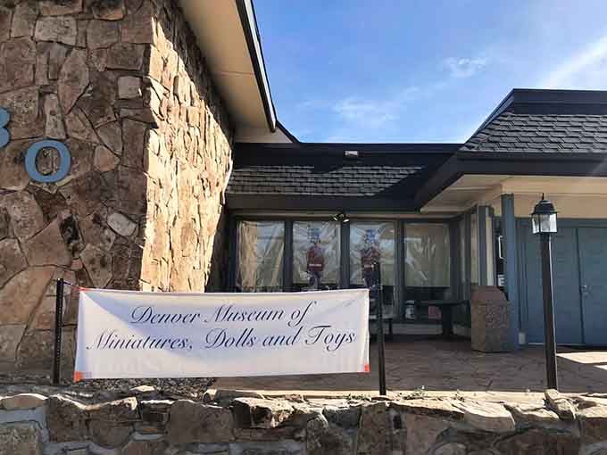 The elegant stonework and welcoming banner promise miniature marvels that'll have you squinting with delight at every display.