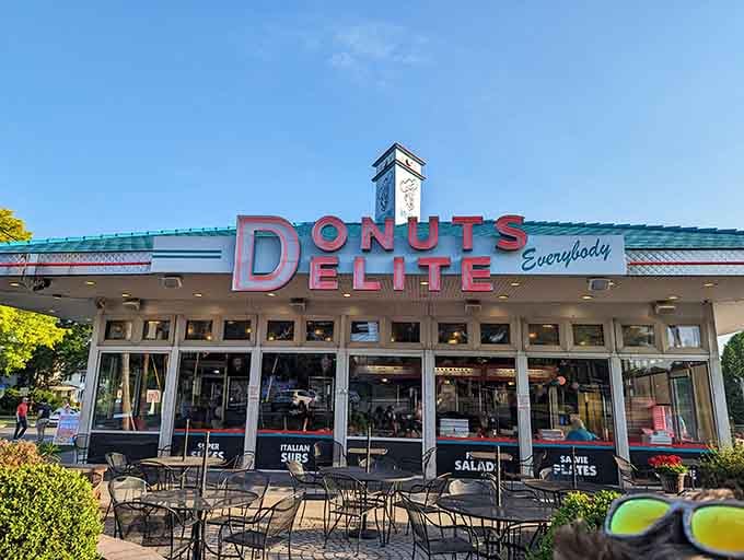Classic retro architecture meets modern donut perfection, complete with outdoor seating for the full experience you deserve.