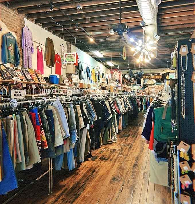 Inside, wooden floors and endless racks create a treasure hunter's paradise where every visit reveals something completely different.