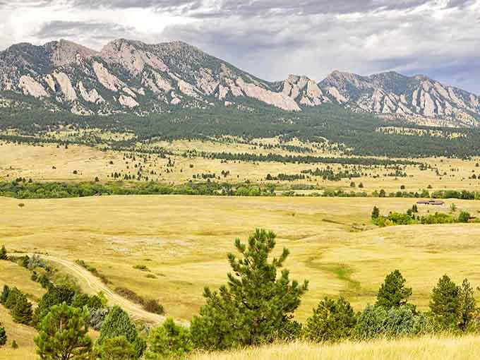 Storm clouds gather over golden meadows while those iconic rock formations stand their ground like they have for eons.
