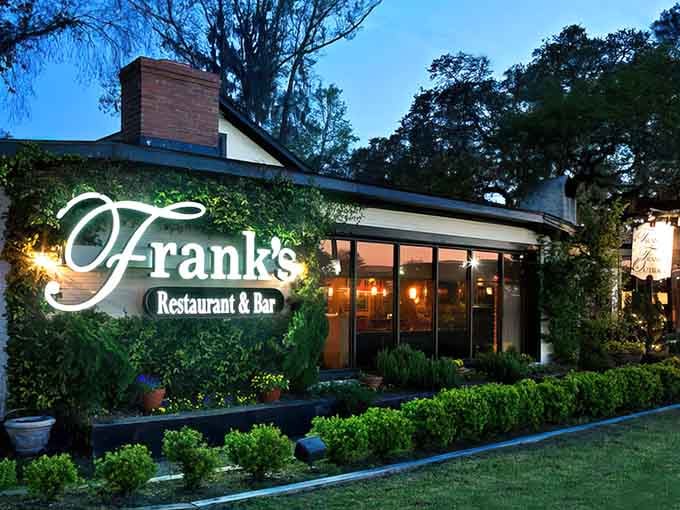 Evening ambiance at its finest&mdash;climbing vines and warm lighting create an irresistible invitation to dine outside.