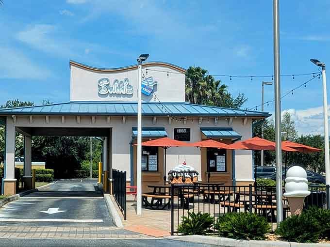 Red umbrellas and blue picnic tables create the perfect stage for enjoying swirls under Orlando's sunny skies together.