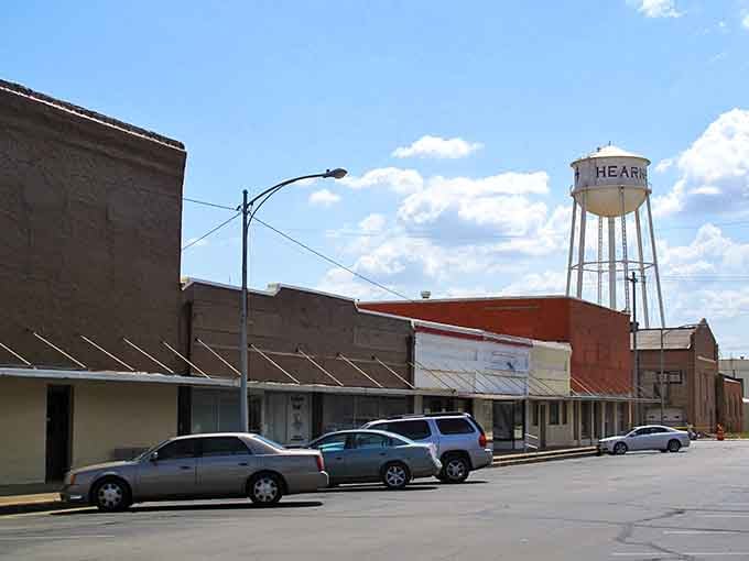 That water tower stands watch like a friendly lighthouse guiding hungry travelers to downtown delights.