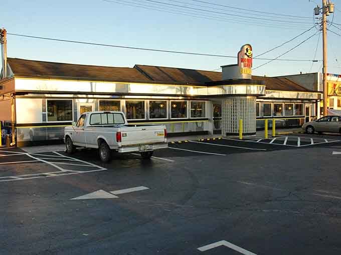 The vintage diner architecture catches the golden hour light perfectly, beckoning hungry travelers to pull over.
