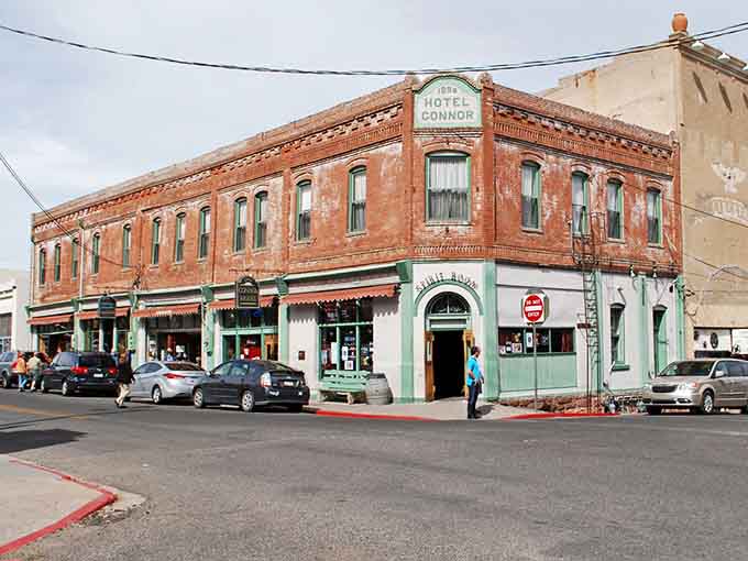 Classic storefronts line this sloping street where gravity adds character to every step you take.