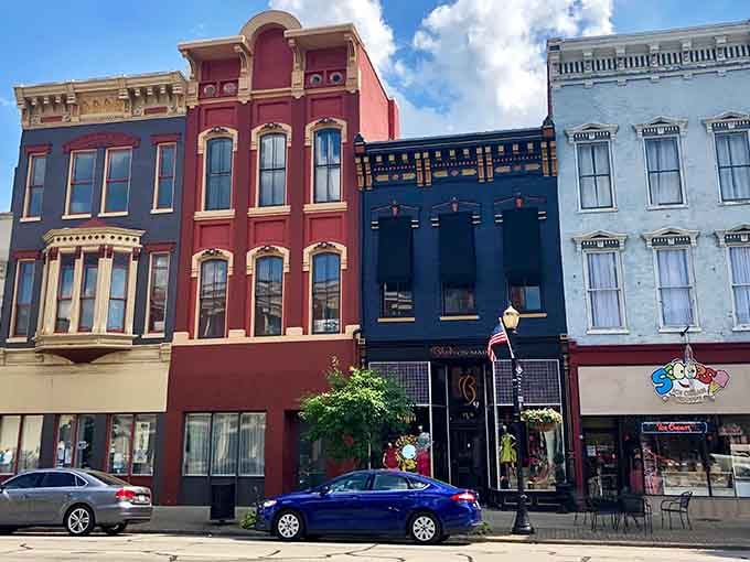 These colorful storefronts pop like candy against the summer sky, each one hiding its own story inside.