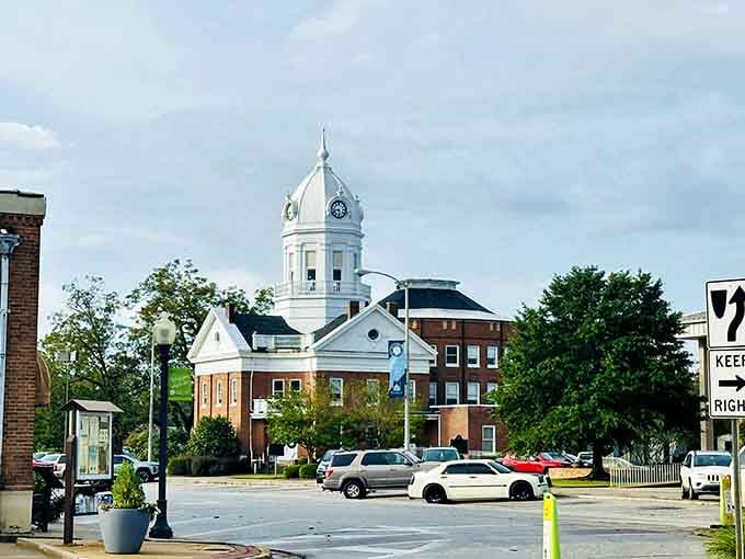 The white cupola rises above the rooftops like a promise that some places refuse to forget their roots.