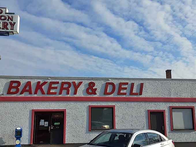 The simple white building with red trim looks like it stepped out of a Norman Rockwell painting, donuts included.