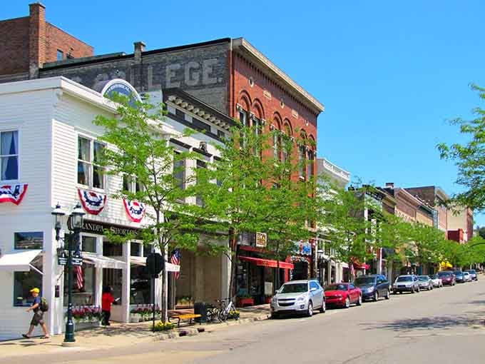 Tree-lined streets frame historic architecture where community spirit thrives in every charming corner and local shop.