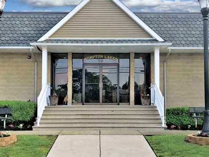 The welcoming entrance to community life, where neighbors gather and friendships bloom over coffee and conversation.