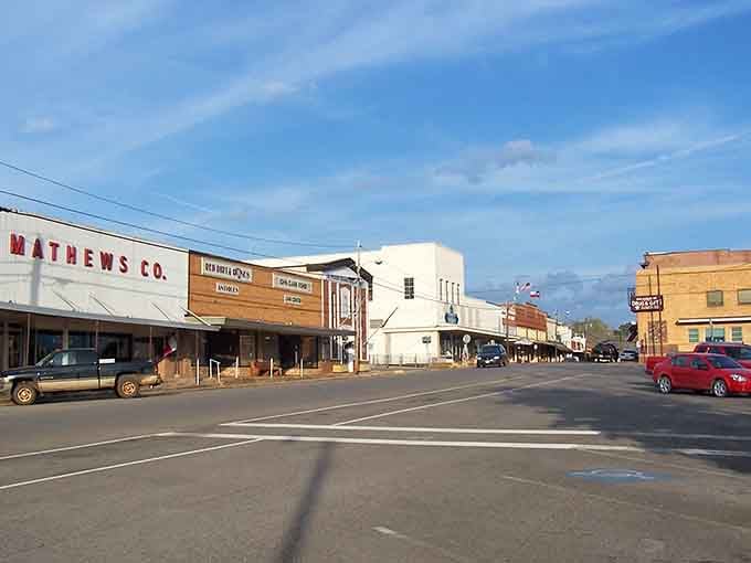 Long shadows stretch across this historic square where every storefront whispers stories from generations past and present.