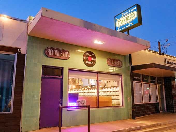 When the purple door glows at dusk, you know the vinyl gods are smiling on this neighborhood gem.