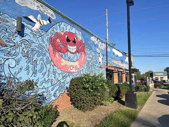 The ocean mural wraps around the building like a love letter to coastal dining done right inland.