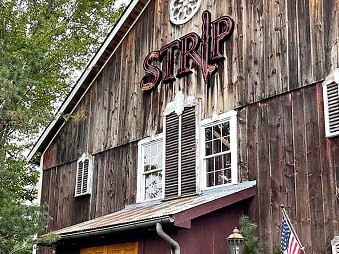 Rustic barn siding and bold signage prove that great steakhouses don't need fancy facades to deliver excellence.