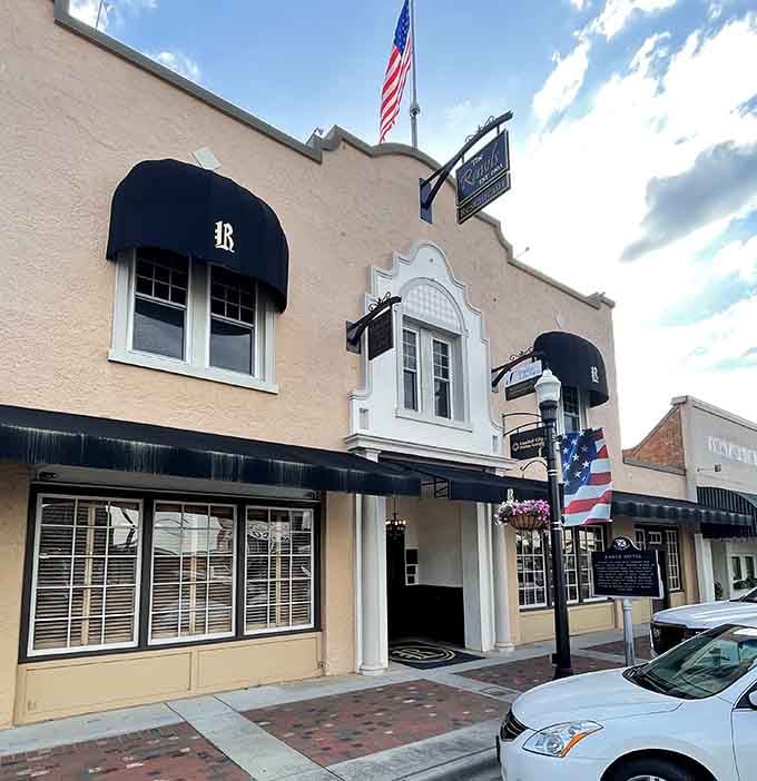 The elegant entrance with its patriotic bunting welcomes living guests warmly while the unseen residents watch quietly.