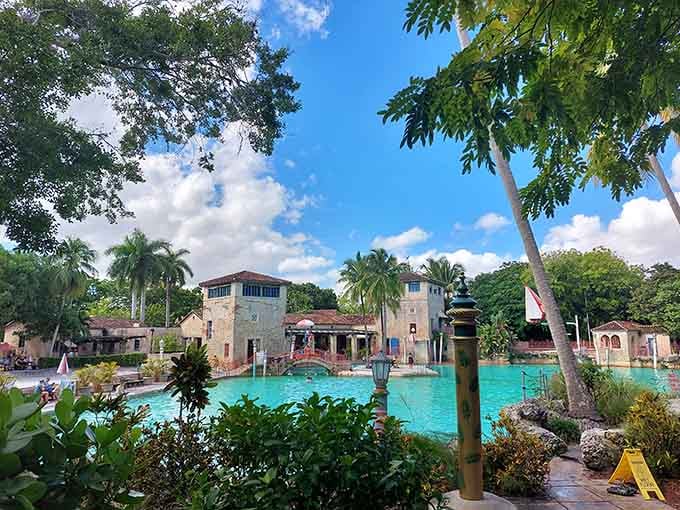 Palm trees frame this architectural swimming masterpiece where Old World elegance meets refreshing Florida practicality beautifully every day.