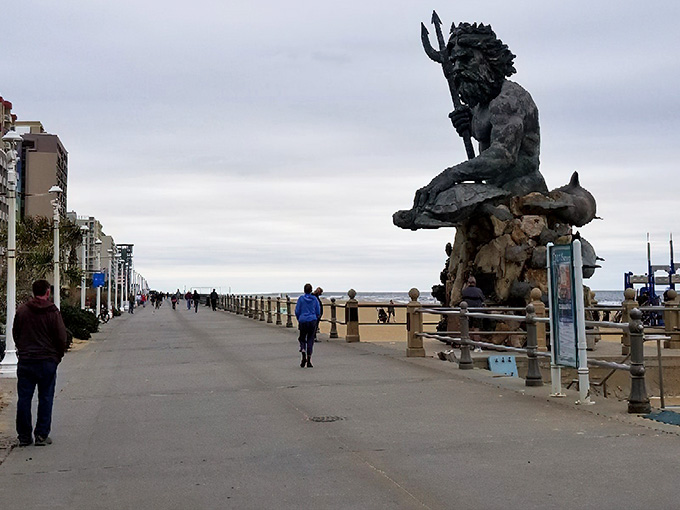 Neptune himself watches over this seaside promenade, his trident raised as if conducting the symphony of crashing waves below.