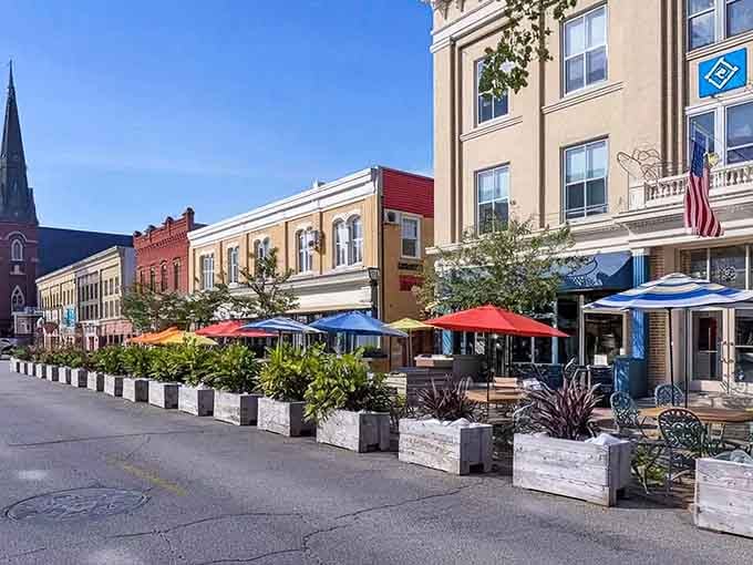 Outdoor dining under bright umbrellas shows a community confident enough to relax and enjoy the moment together.