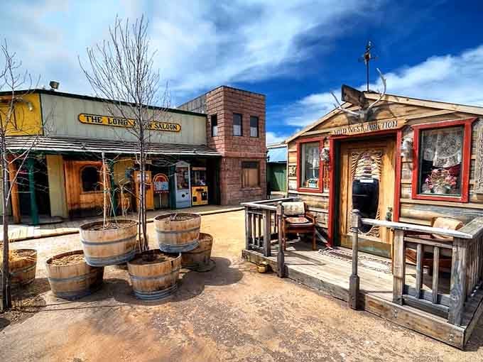 Weathered barrels and rustic benches create an authentic frontier courtyard that feels like stepping onto a movie set.