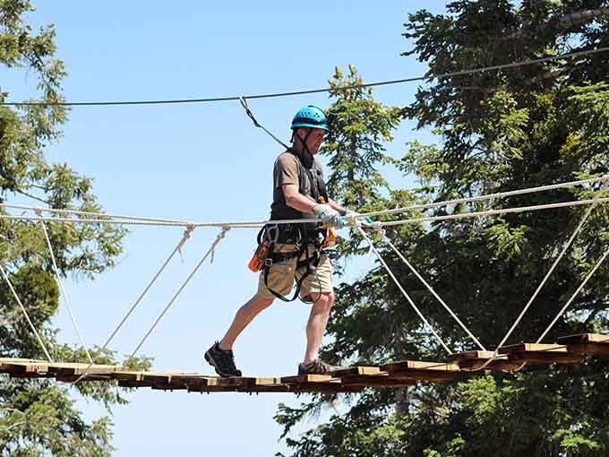 Clipped in and ready to roll, because sometimes adulting means playing in the trees like you're seven again.