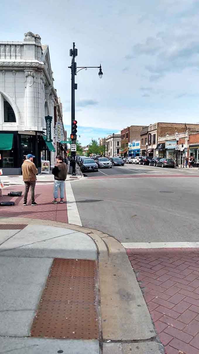 Clark Street's wide sidewalks invite leisurely strolls, the kind where you actually notice things instead of dodging tourists.