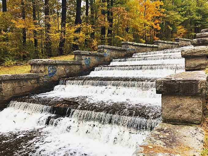 Water cascading over stone steps like nature's own stairway, proving the best architecture needs no architect at all.