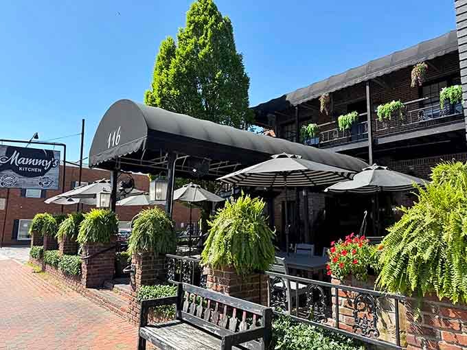 Cascading ferns and outdoor seating create the perfect spot to watch the world slow down to a civilized pace.